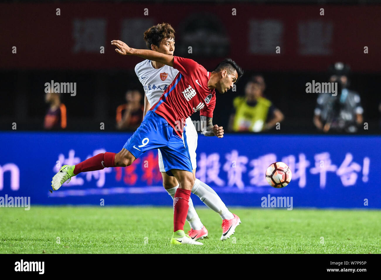Filipino soccer player Javier Patino, right, of Henan Jianye ...