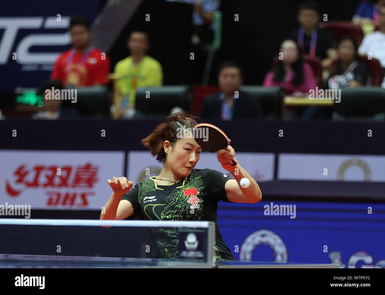 Ding Ning of China returns a shot to Sun Yingsha of China in the final ...