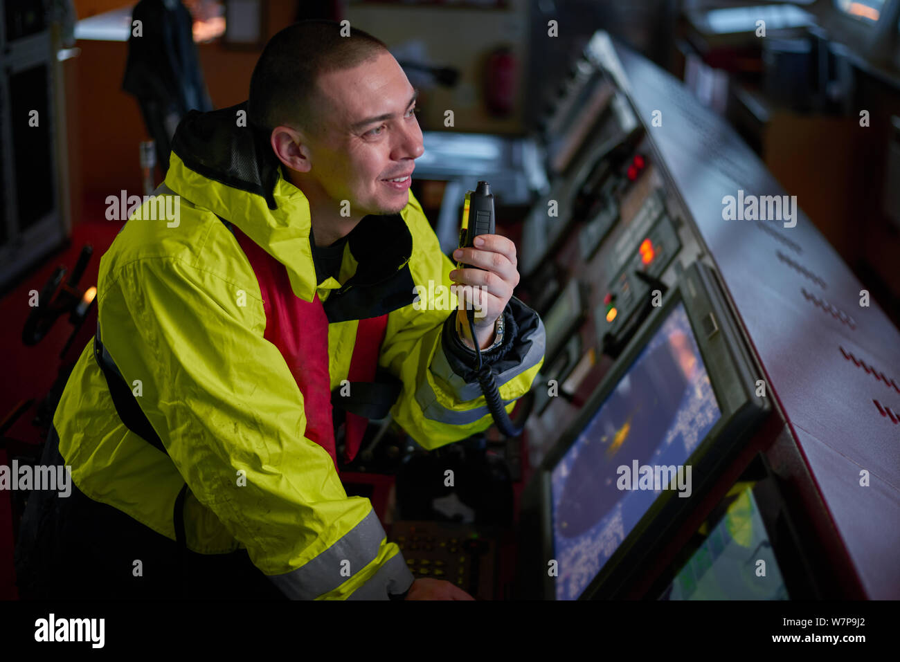 Navigator. pilot, captain as part of ship crew performing daily duties ...