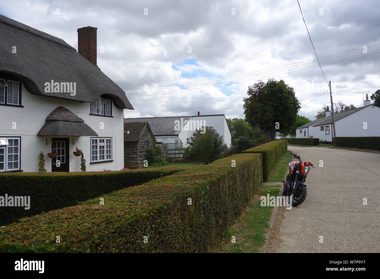 Rushbrooke estate village, Suffolk. Early 1900s thatched cottage built ...