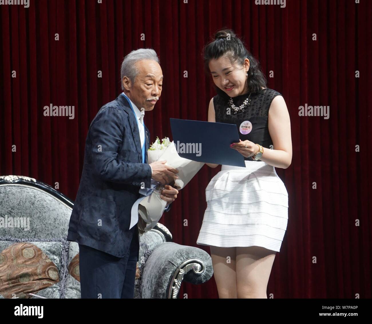 Japanese singer-songwriter Tanimura Shinji, left, attends a press ...
