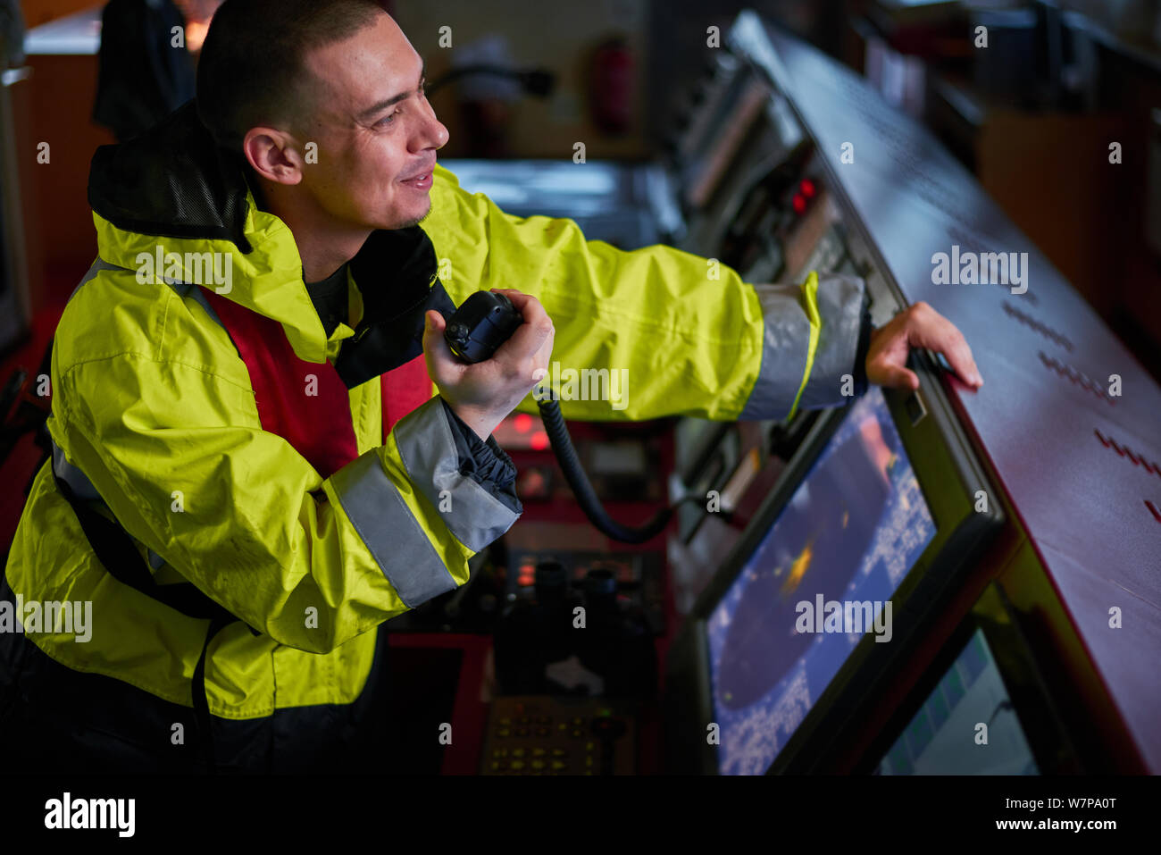 Navigator. pilot, captain as part of ship crew performing daily duties ...