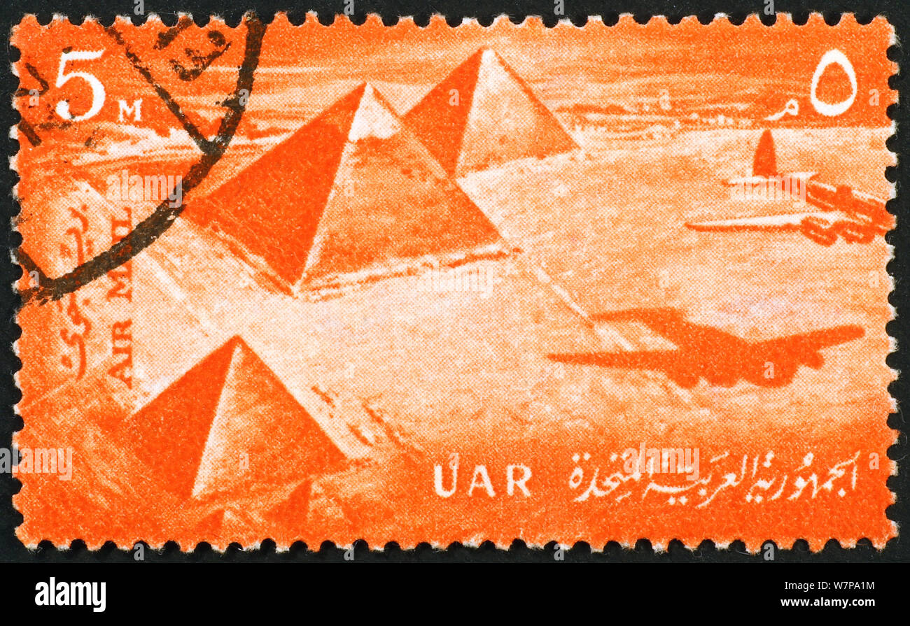 Egyptian vintage stamp with airplane flying over pyramids Stock Photo ...