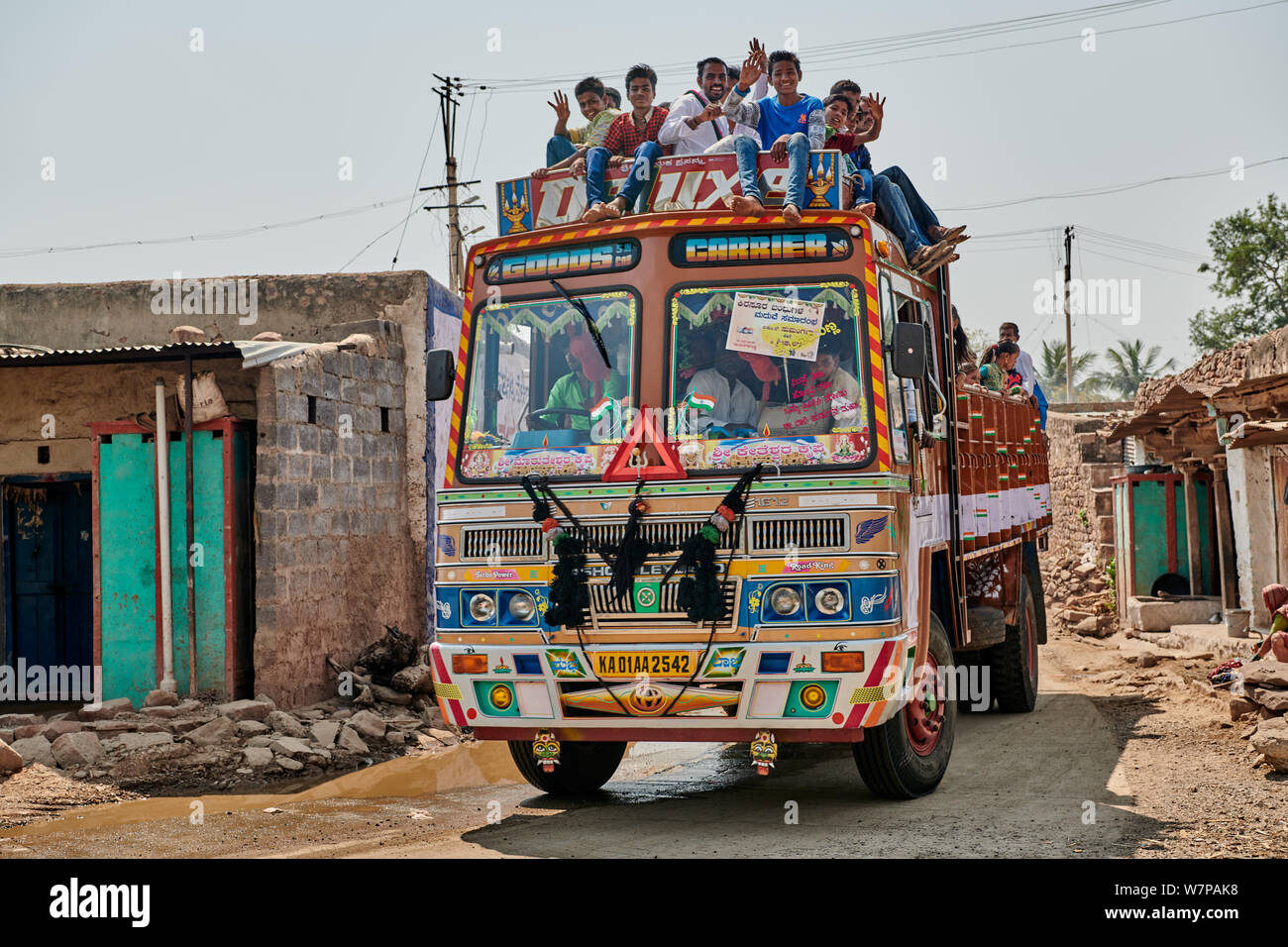 colorful truck used as bus loaded with people, Aihole, Karnataka, India ...
