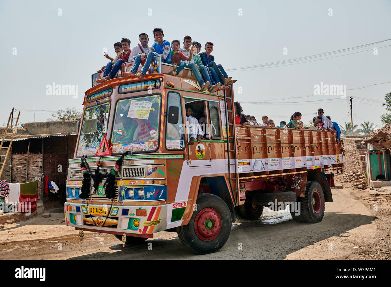 colorful truck used as bus loaded with people, Aihole, Karnataka, India ...