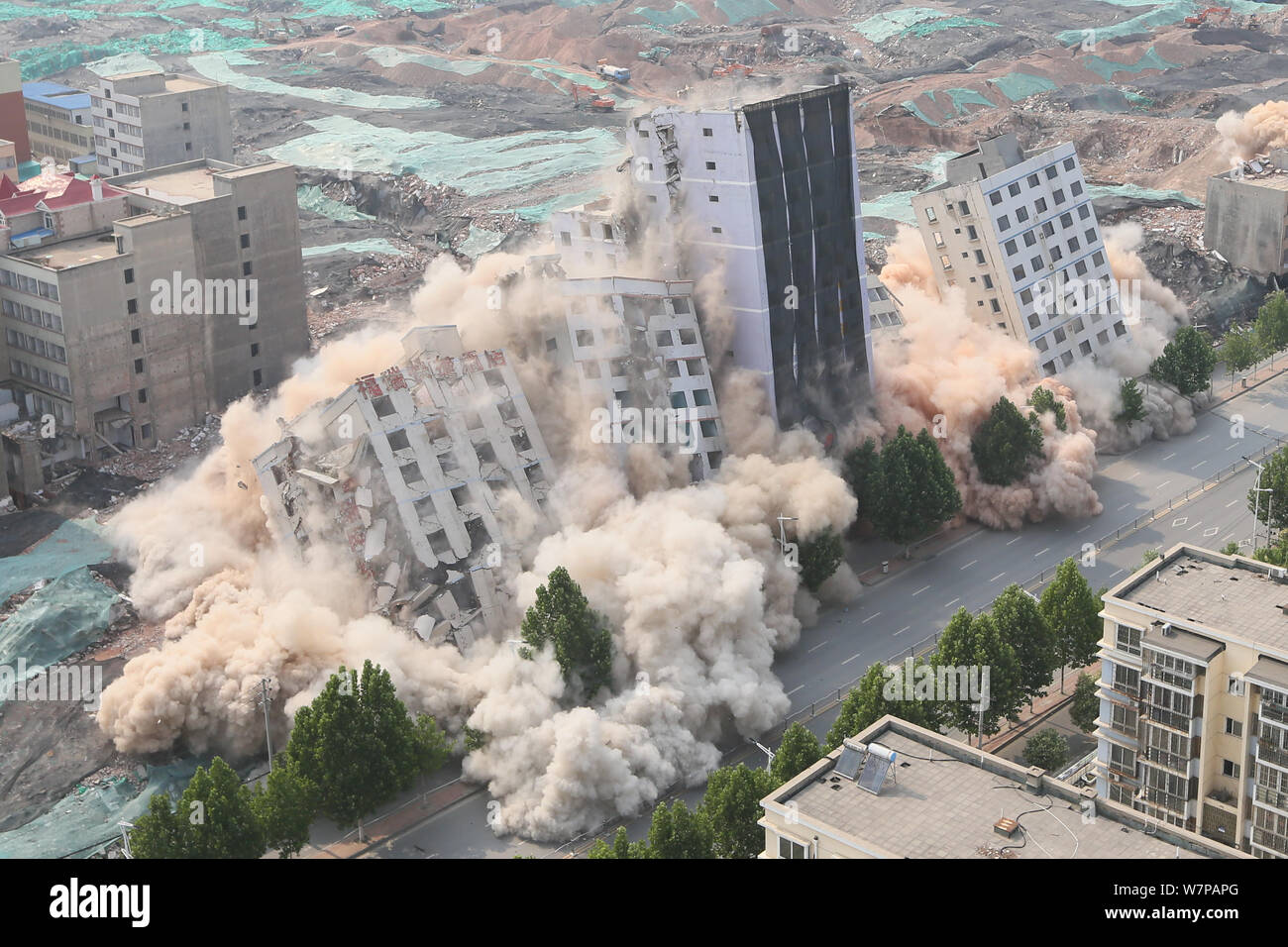 Dense smoke rises after six buildings ranging from 7 to 12 storeys high ...