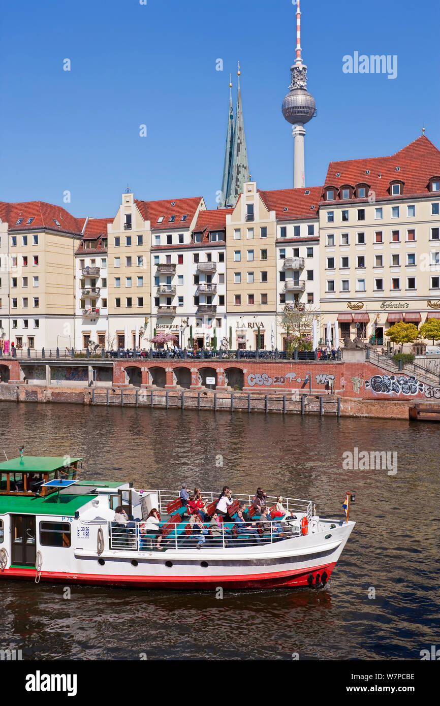 Tour boat on the Spree Canal in front of St. Nicholas Quarter, Berlin ...