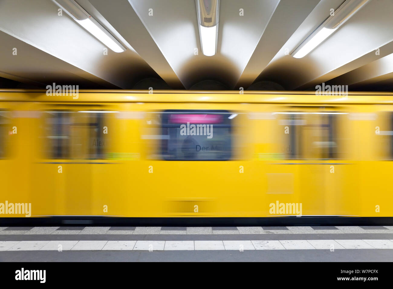 Moving train pulling into the station of modern subway station, Berlin ...