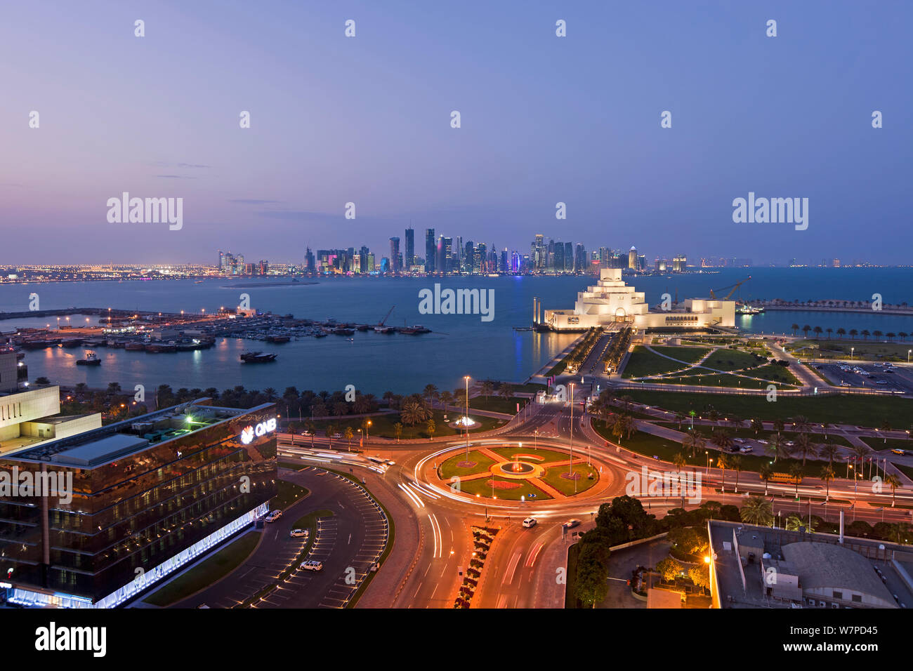 Elevated view at dusk over the Museum of Islamic Art and the Dhow ...