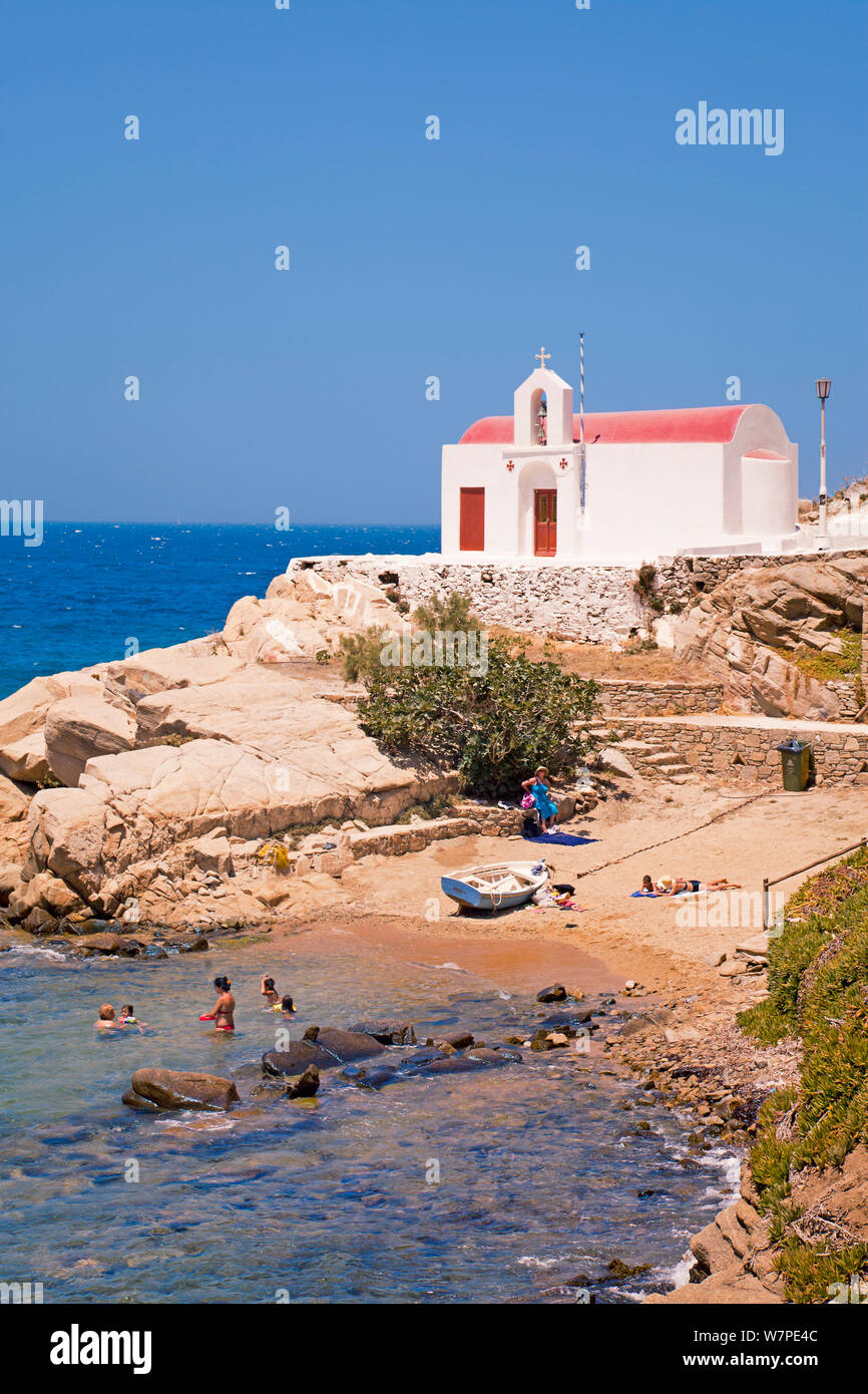 People bathing in the sea off Mykonos (Hora), Cyclades Islands, Greece ...