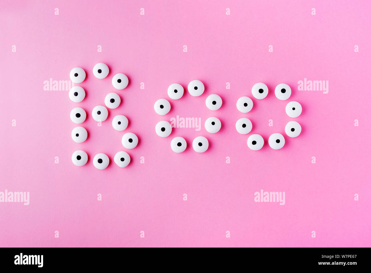 Creative flat lay top view pattern with Halloween googly eyes candy for ...