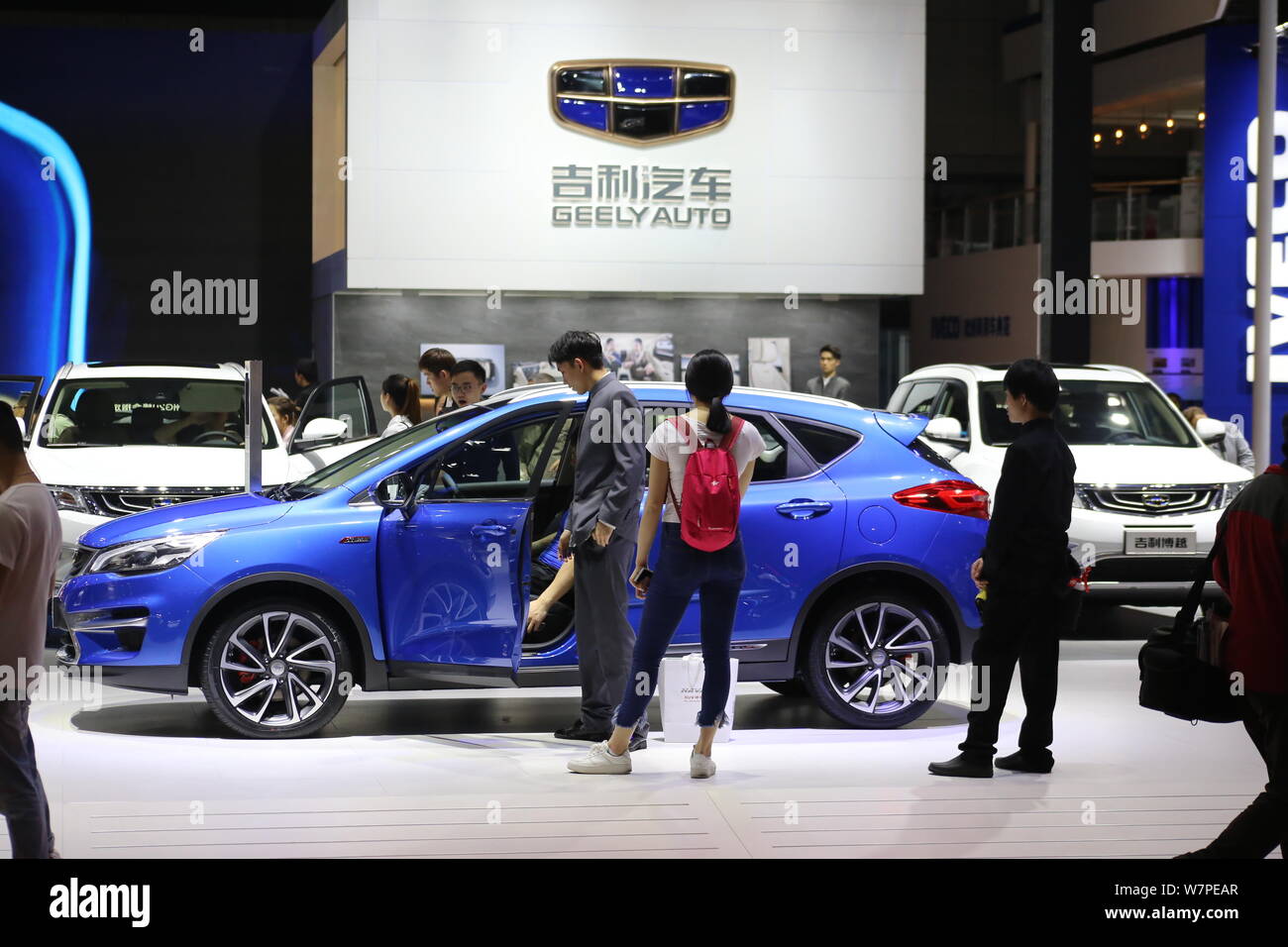 --FILE--People visit the stand of Geely during the 17th Shanghai ...