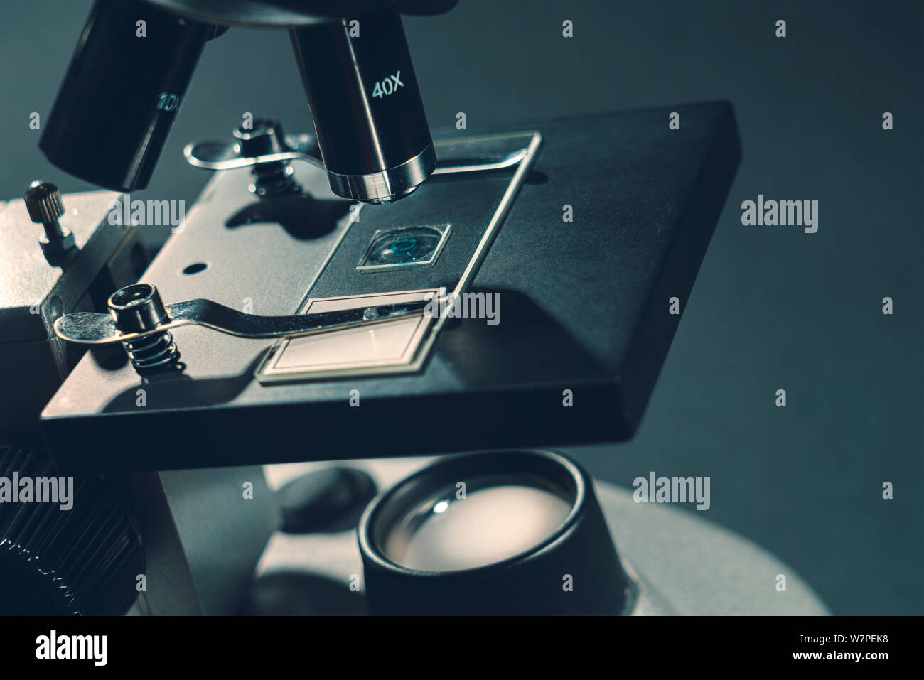 details of a silver microscope, with black background Stock Photo - Alamy