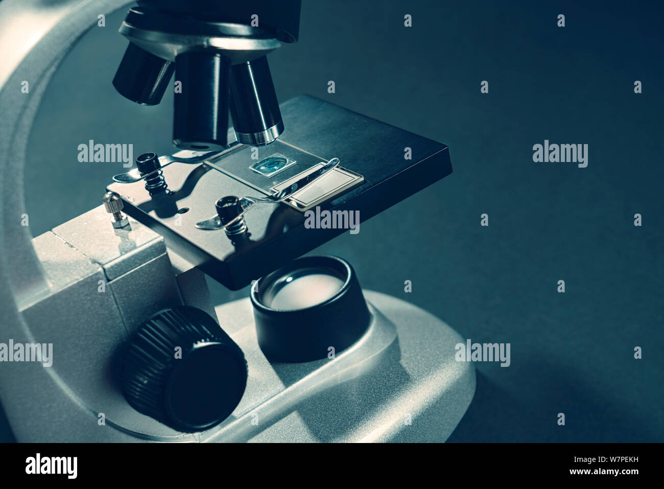details of a silver microscope, with black background Stock Photo - Alamy