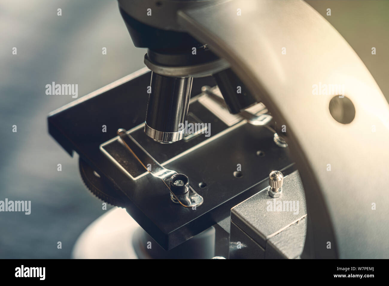details of a silver microscope, with black background Stock Photo - Alamy