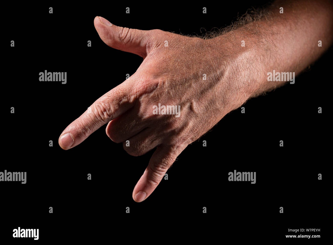 hand making a rock sign gesture, isolated on black Stock Photo - Alamy