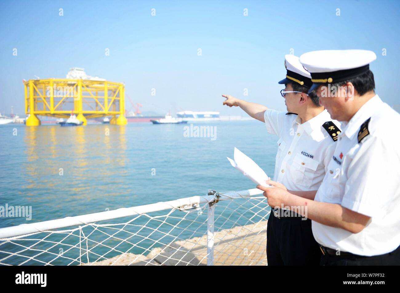 Chinese customs officers look at the Ocean Farm 1, an intelligent ...