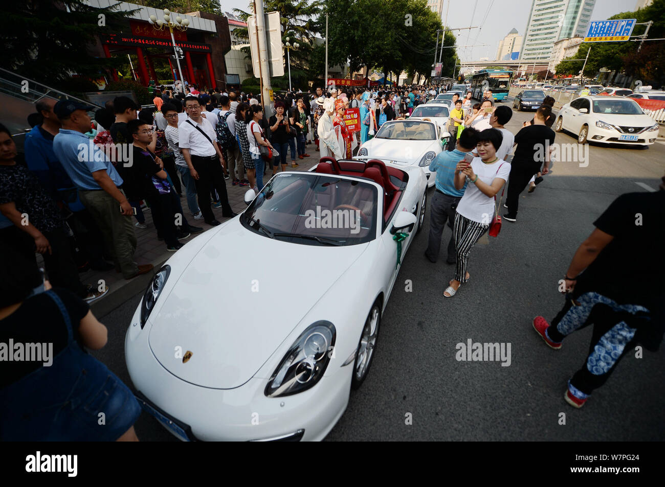 Sports cars arrive at the Shandong Experimental High School as part of ...