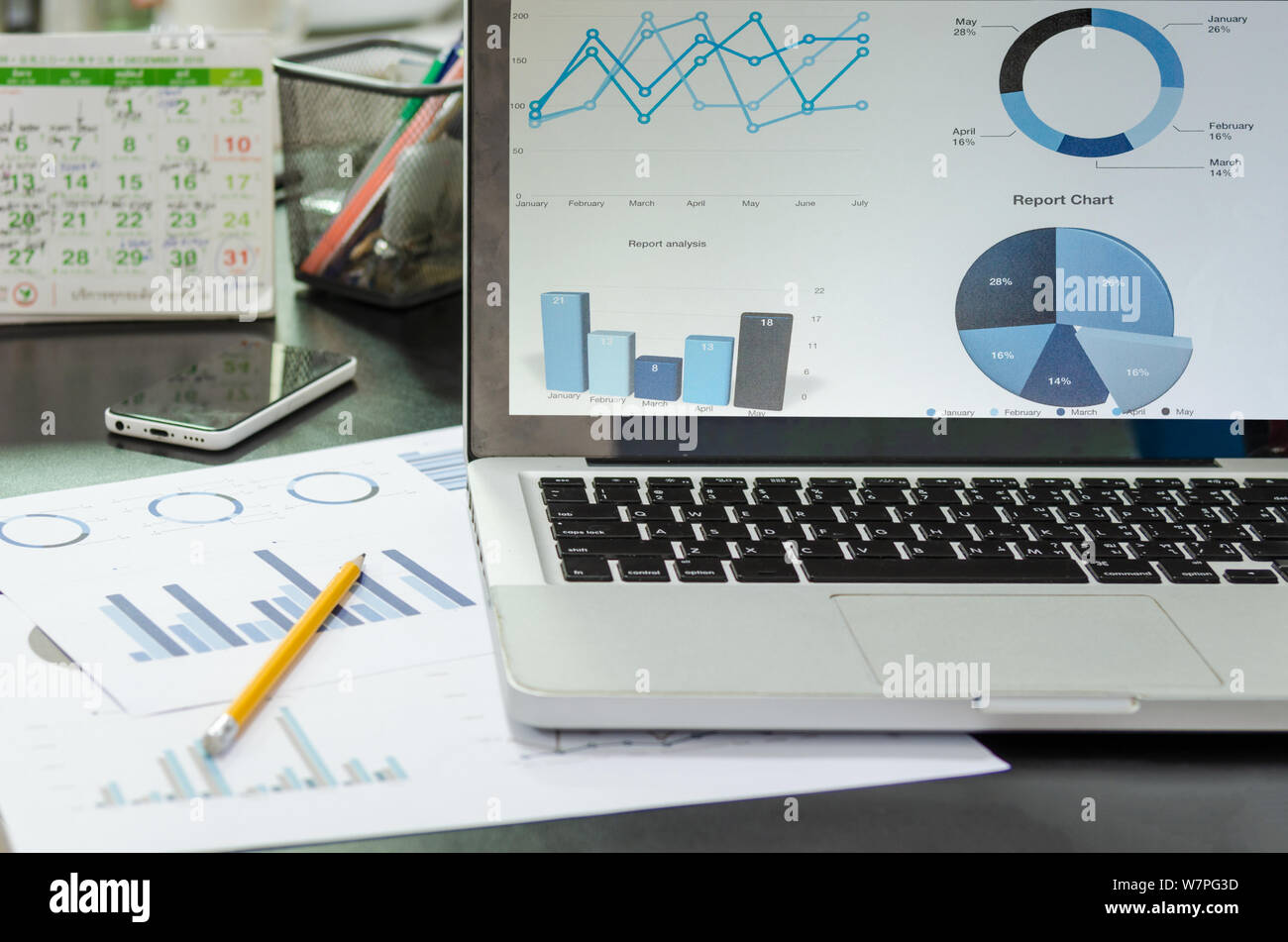 business graph on the desk Stock Photo - Alamy