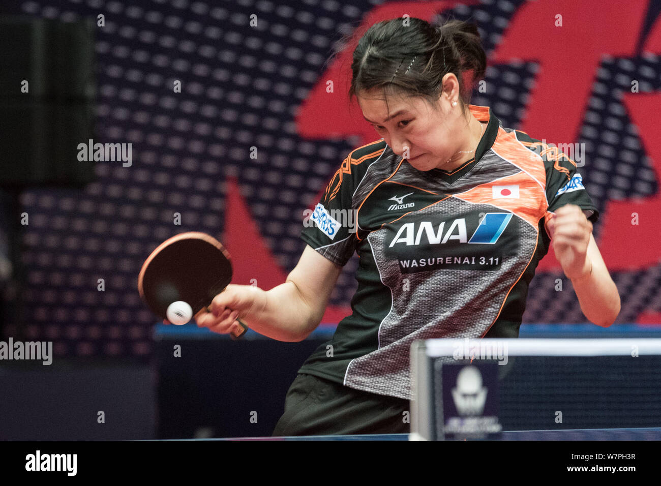 Yui Hamamoto of Japan returns a shot as she and Kasumi Ishikawa compete ...