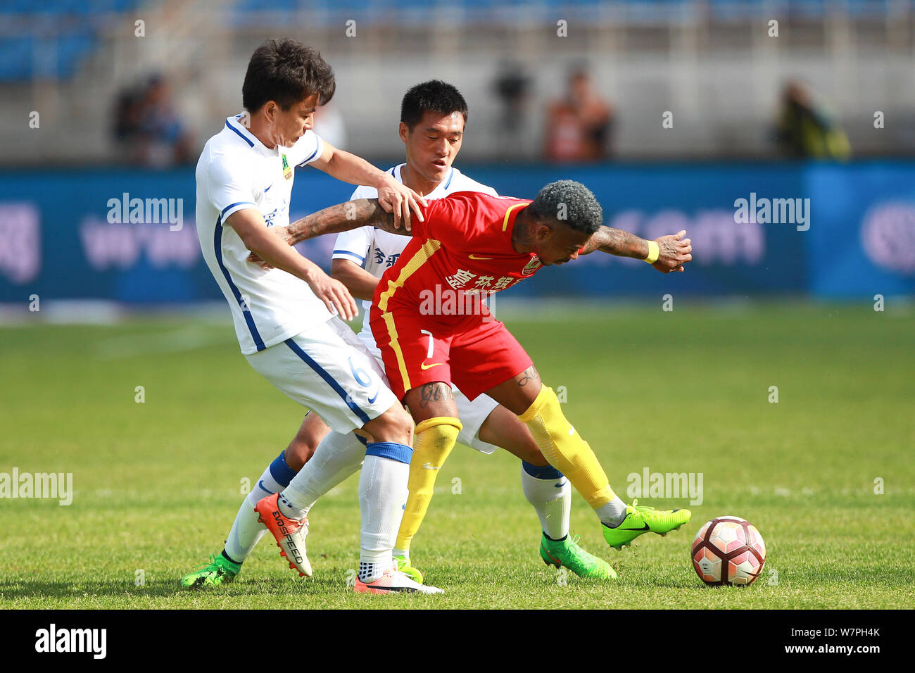 Brazilian football player Marinho, right, of Changchun Yatai ...