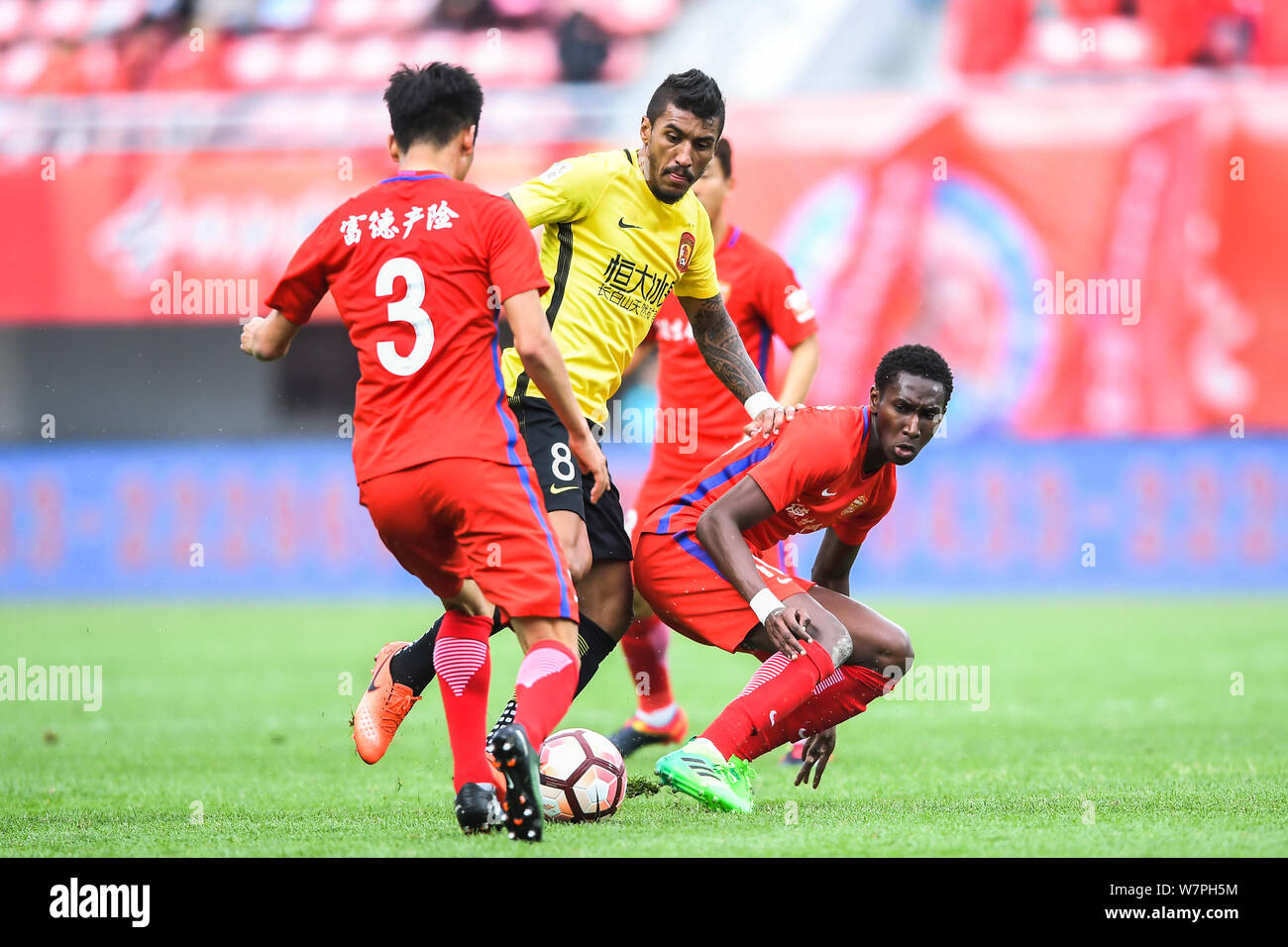 Brazilian football player Paulinho, center, of Guangzhou Evergrande ...