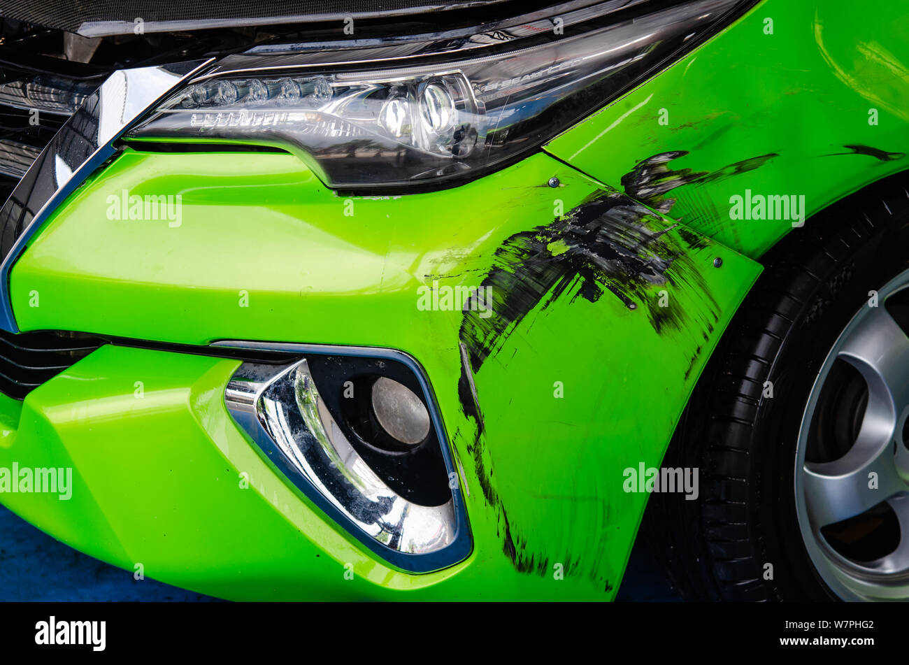 green car bump marks on the front bumper Stock Photo - Alamy