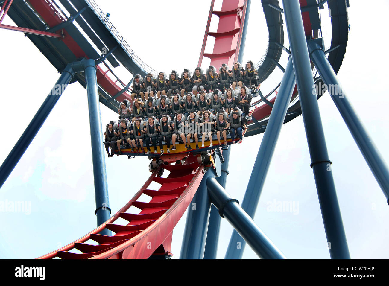 College graduates ride the 60-meter-high roller coaster to celebrate ...