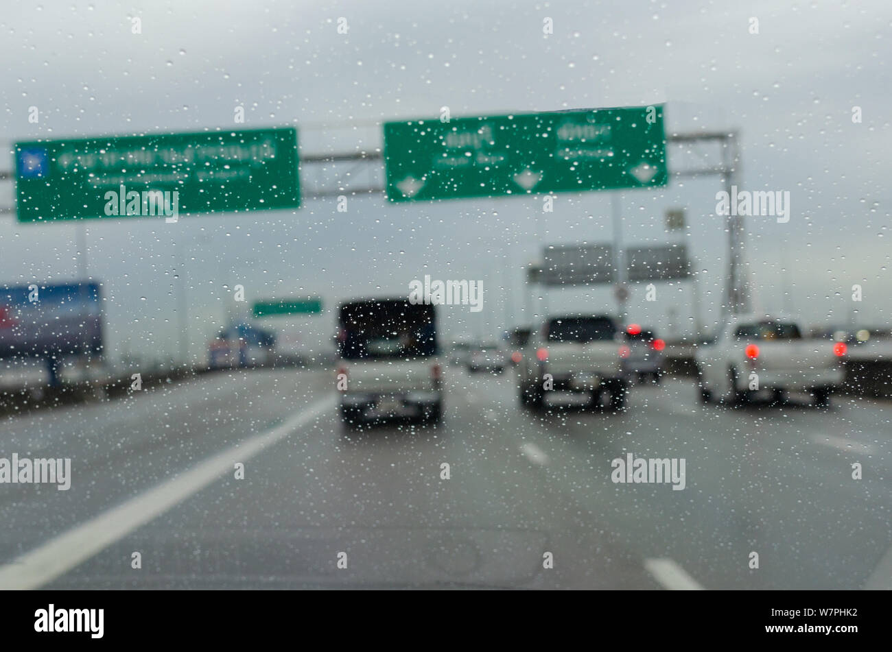 car window with rain drops driving in rain.Traffic jam background ...