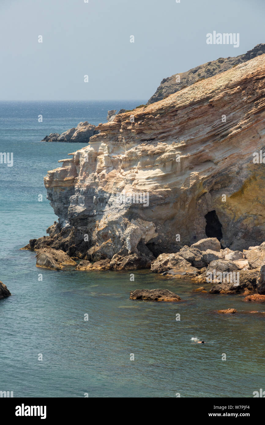 entrance on colorful volcanic cliff on Milos island Stock Photo - Alamy