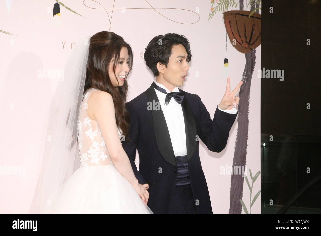 Taiwanese singers Yoga Lin, right, and Kiki Ting attend their wedding ...