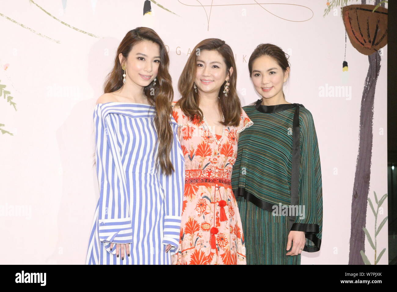 (From left) Hebe, Selina, and Ella of Taiwanese girls group S.H.E pose during the wedding ...
