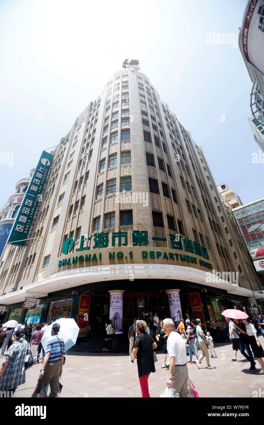 Pedestrians walk past the 81-year-old Shanghai No. 1 Department Store ...