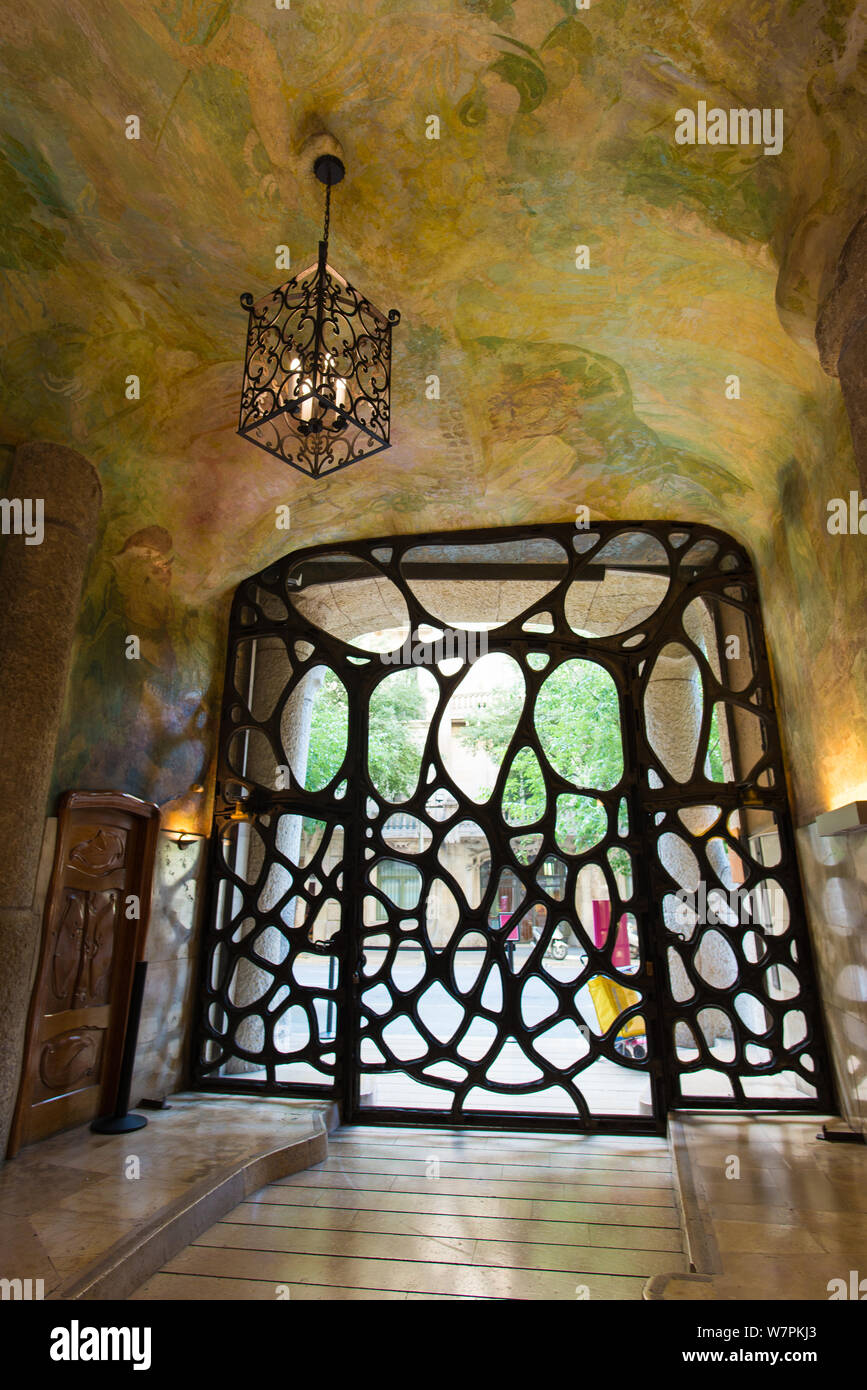 Wrought iron gate designed by Antoni Gaudi leading into courtyard of ...