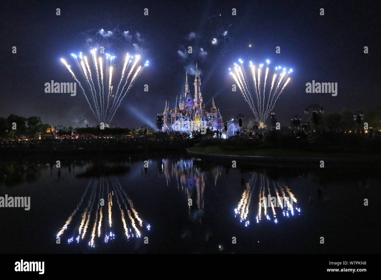 Fireworks explode over the Disney Castle during the first anniversary ...