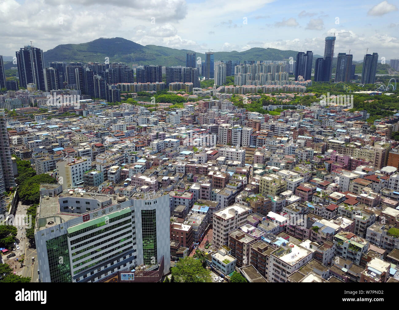 Aerial view of old residential houses and buildings in Baishizhou urban ...
