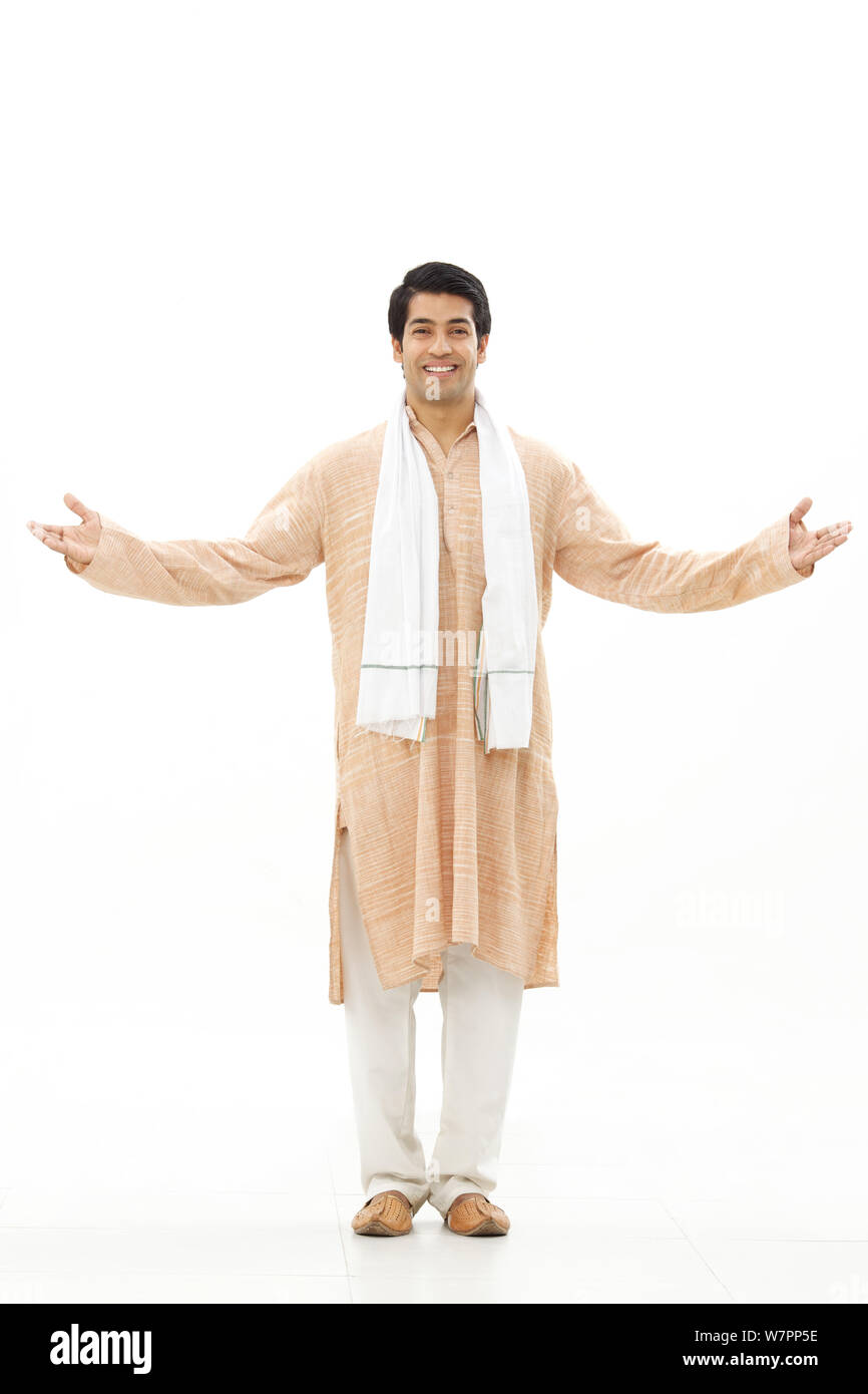 Rural man standing with his arm outstretched Stock Photo - Alamy