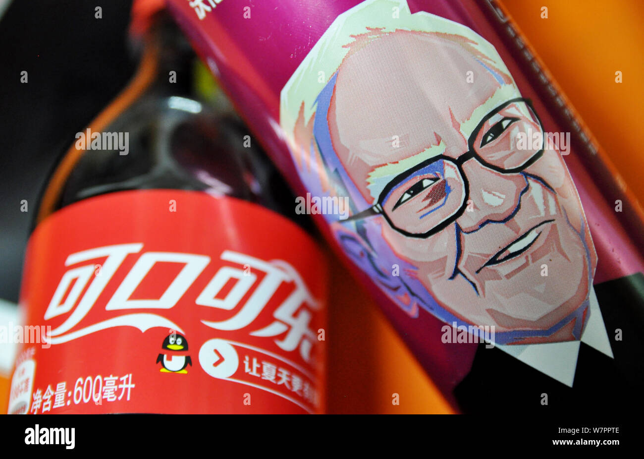 A can of Cherry Coca-Cola with a portrait of Warren Buffett, Chairman ...