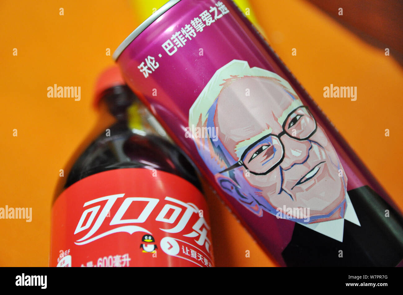 A can of Cherry Coca-Cola with a portrait of Warren Buffett, Chairman ...