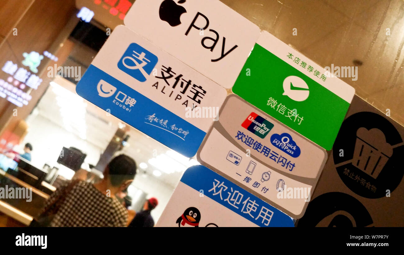 --FILE--A signboard of payments through Apple Pay, Alipay of Alibaba ...