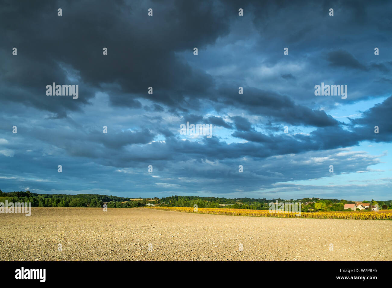 Storm clouds gathering over farmland - France Stock Photo - Alamy