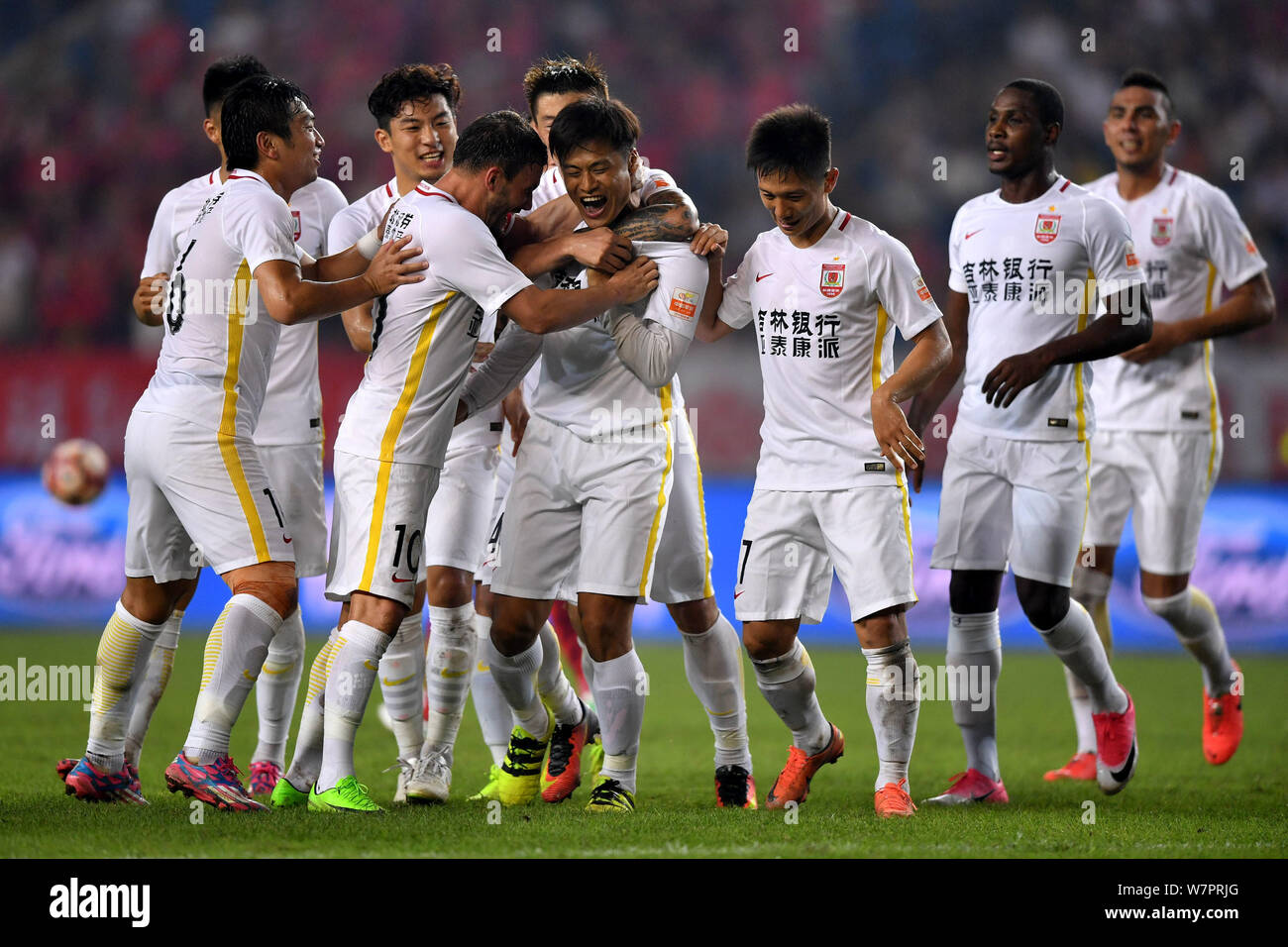 Players of Changchun Yatai celebrate after scoring a goal against ...