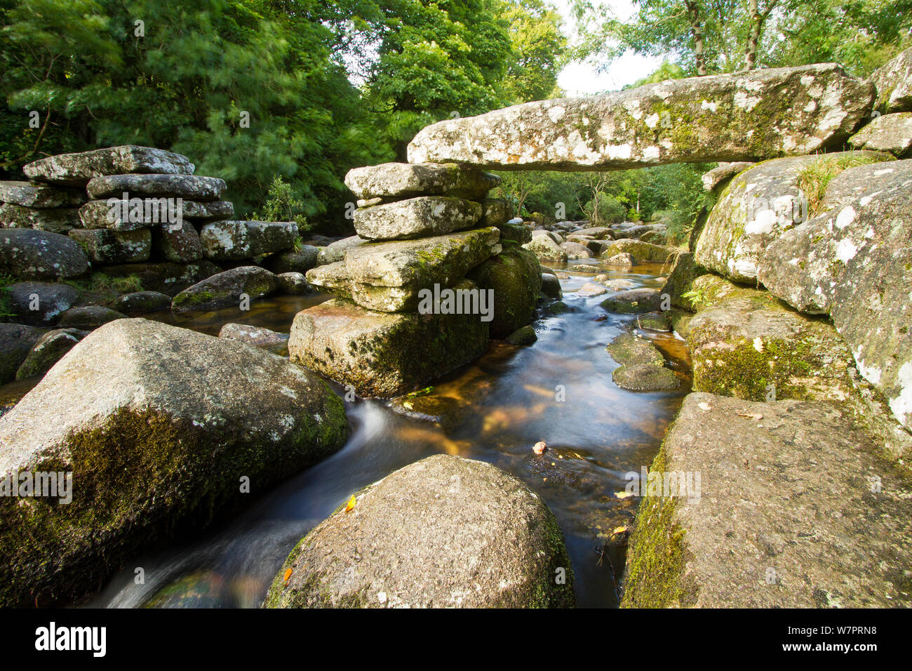 Clapper bridge made from slabs of granite crossing the River Dart at ...