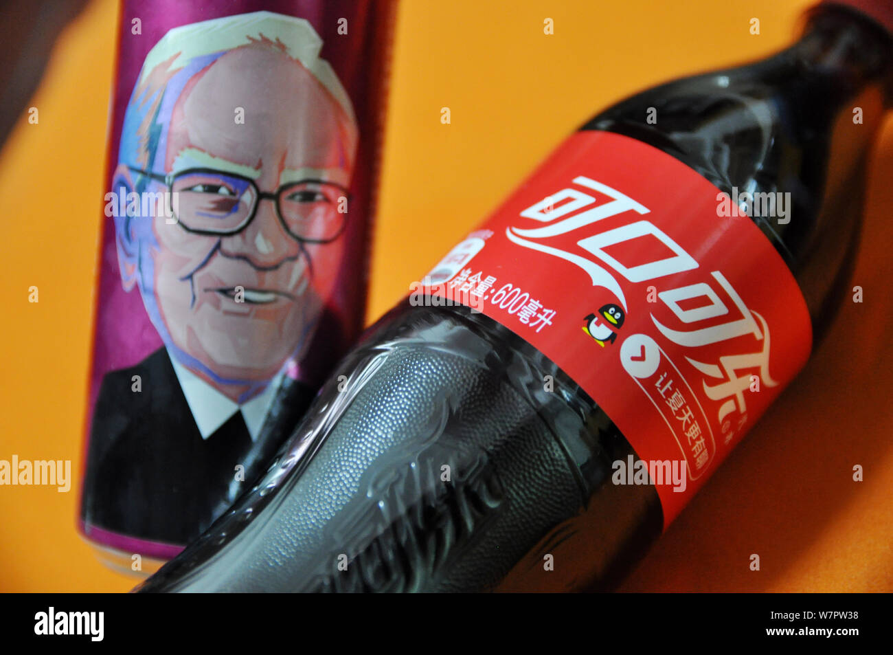 A can of Cherry Coca-Cola with a portrait of Warren Buffett, Chairman ...