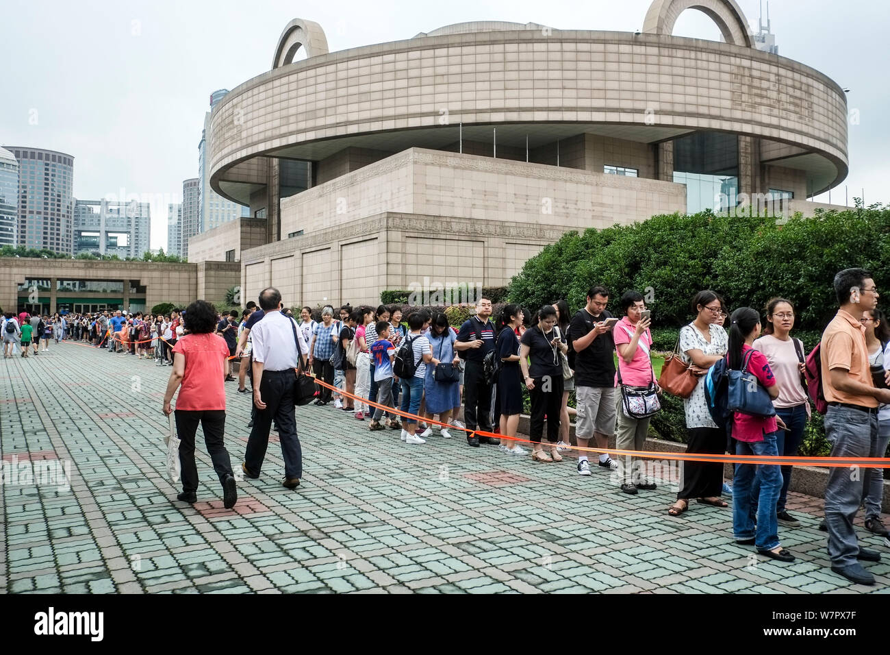 Visitors queue up in a long line to get into Shanghai Museum during the ...