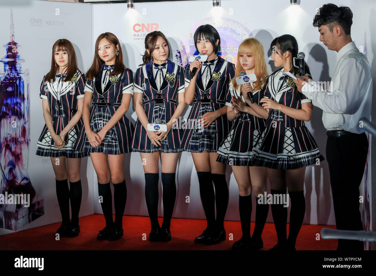 Members of Chinese girl group SNH48 attend a press conference for 2016 ...