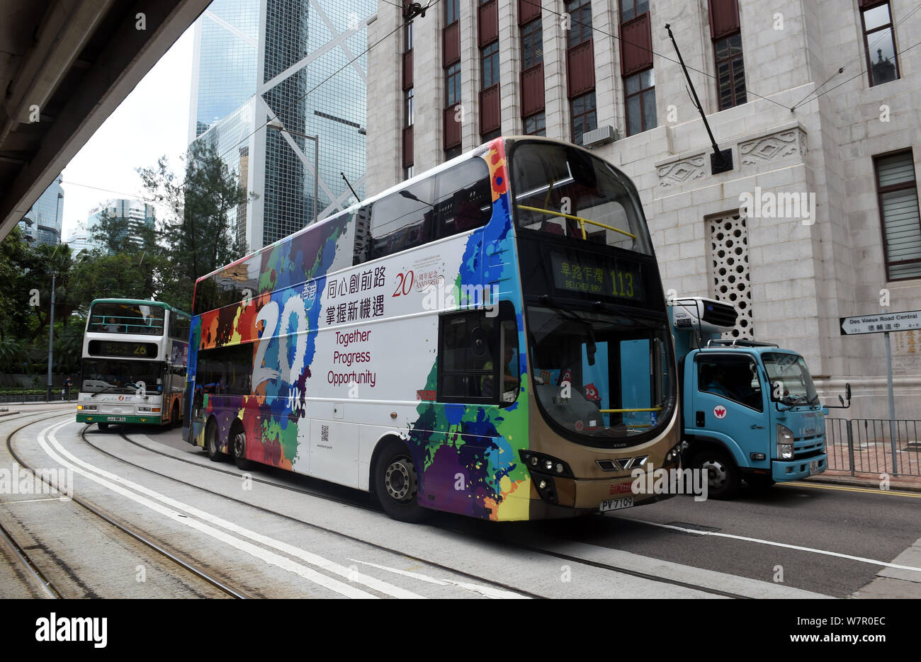 A bus with an advertisement to mark the 20th anniversary of Hong Kong's ...