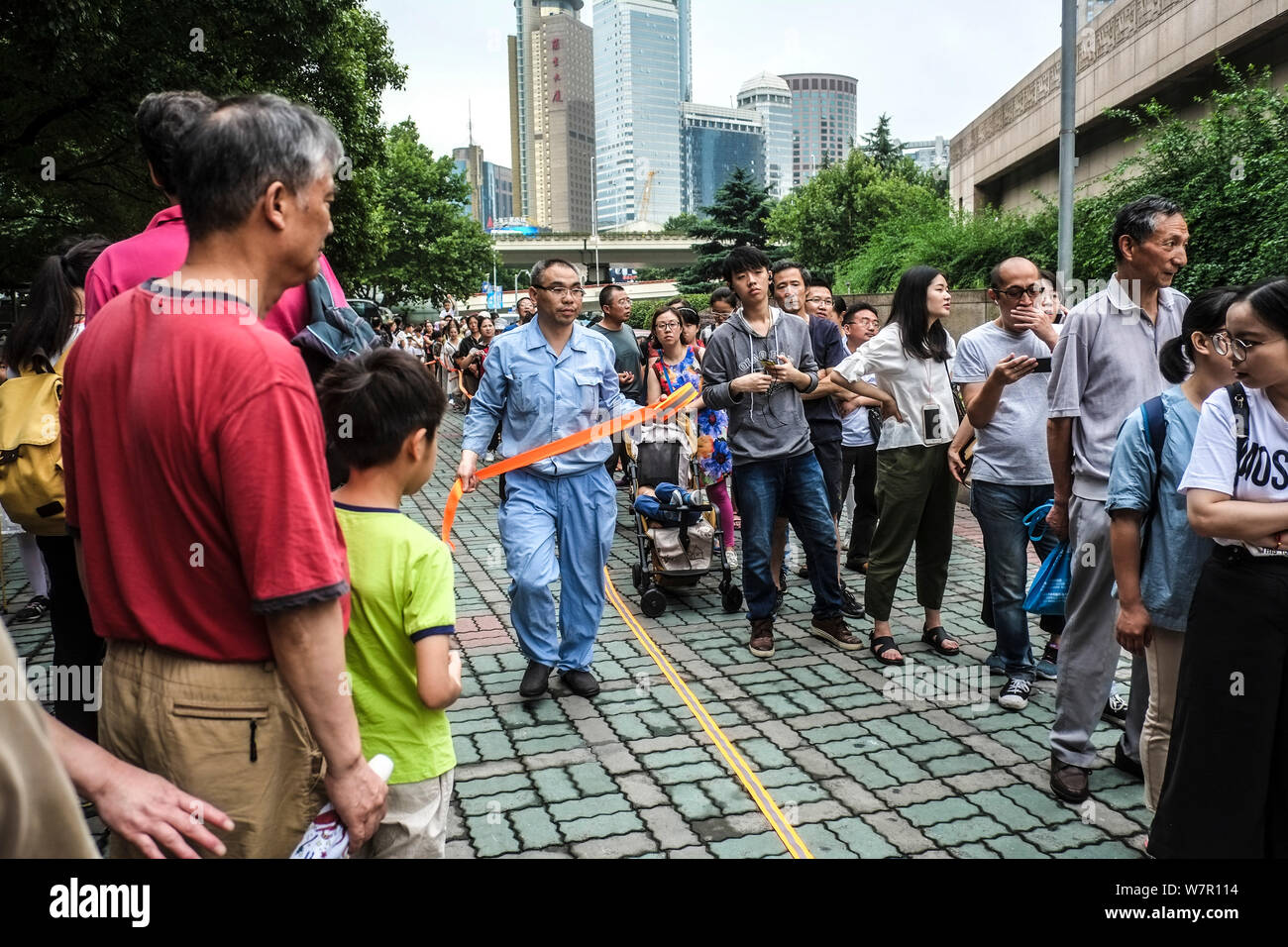 Visitors queue up in a long line to get into Shanghai Museum during the ...