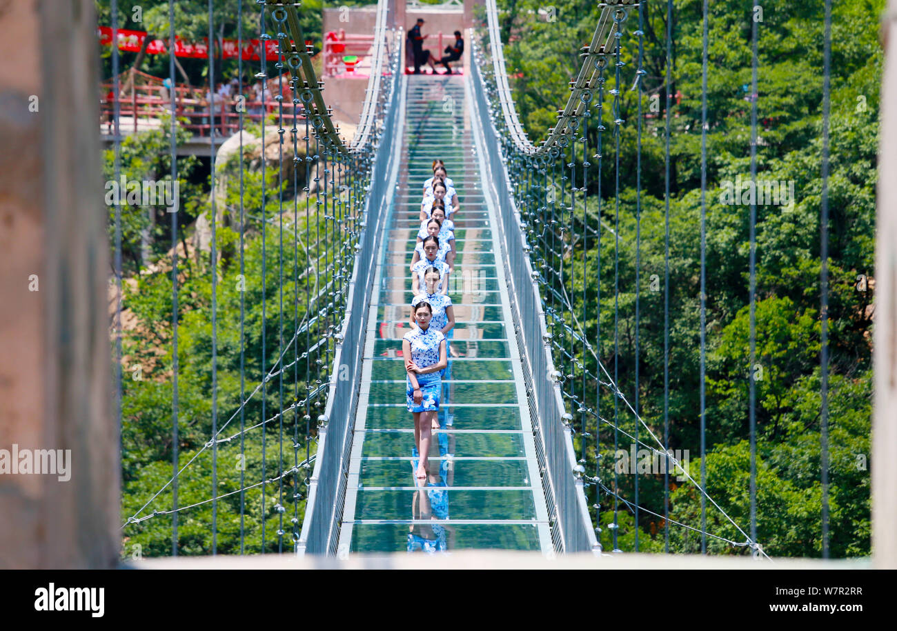 Female graduates dressed in cheongsam, also known as qipao in Chinese ...