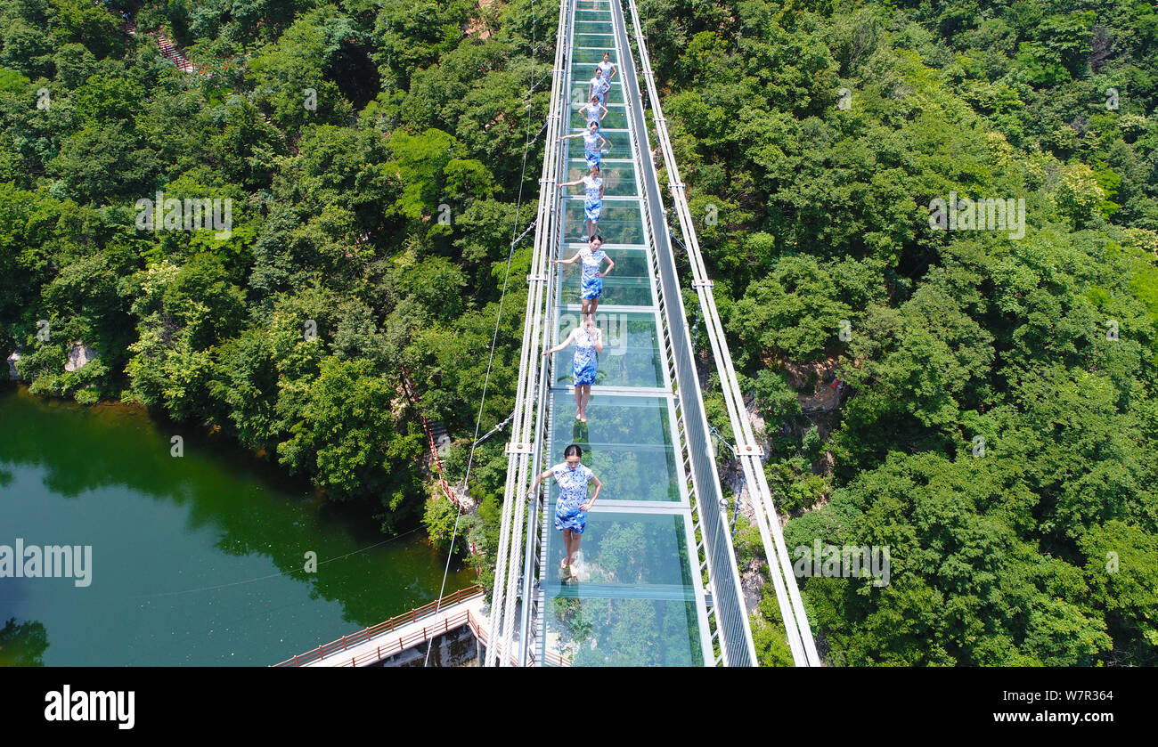 Female graduates dressed in cheongsam, also known as qipao in Chinese ...